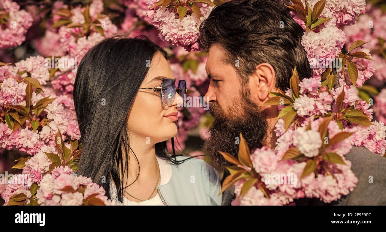 Falling on love. In love with spring. Couple in love cuddling outdoors ...