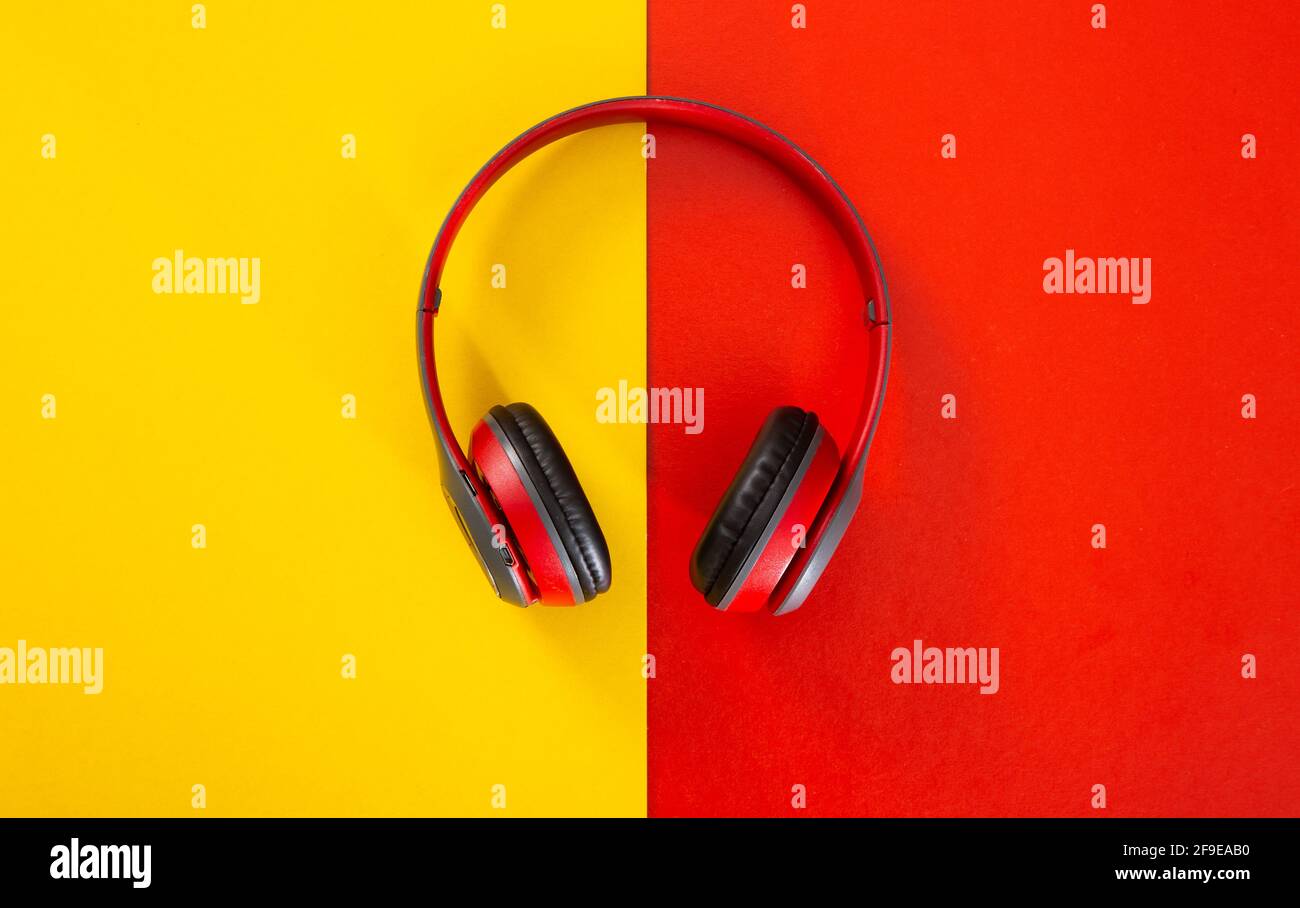 headphones on red and yellow background. Music concept Stock Photo - Alamy