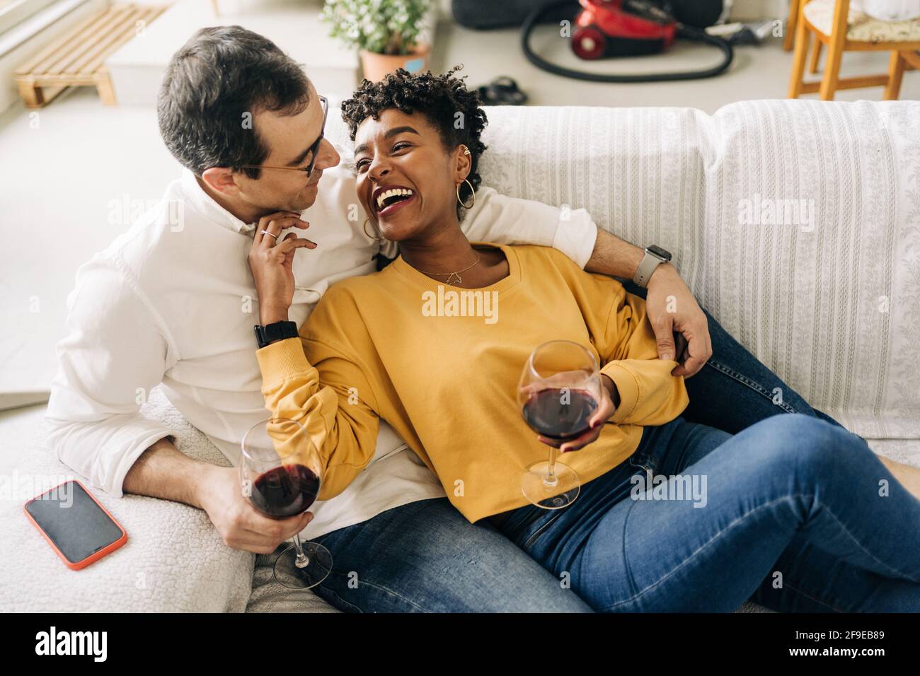 Couple chilling on sofa hi-res stock photography and images - Alamy