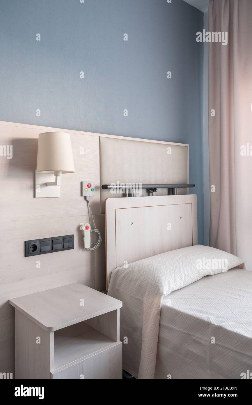 Nurse call system with emergency buttons installed near bed in ...