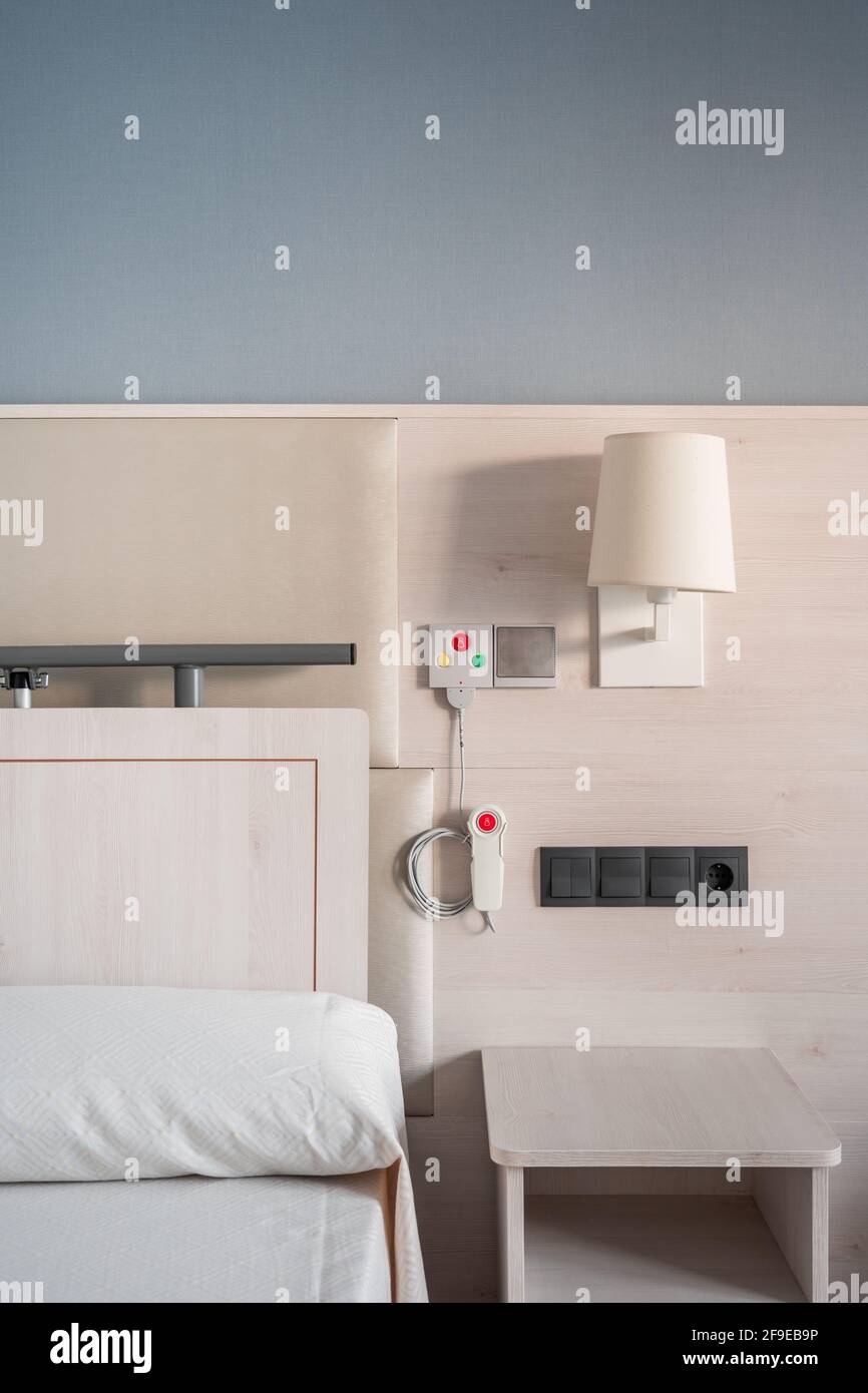 Nurse call system with emergency buttons installed near bed in ...