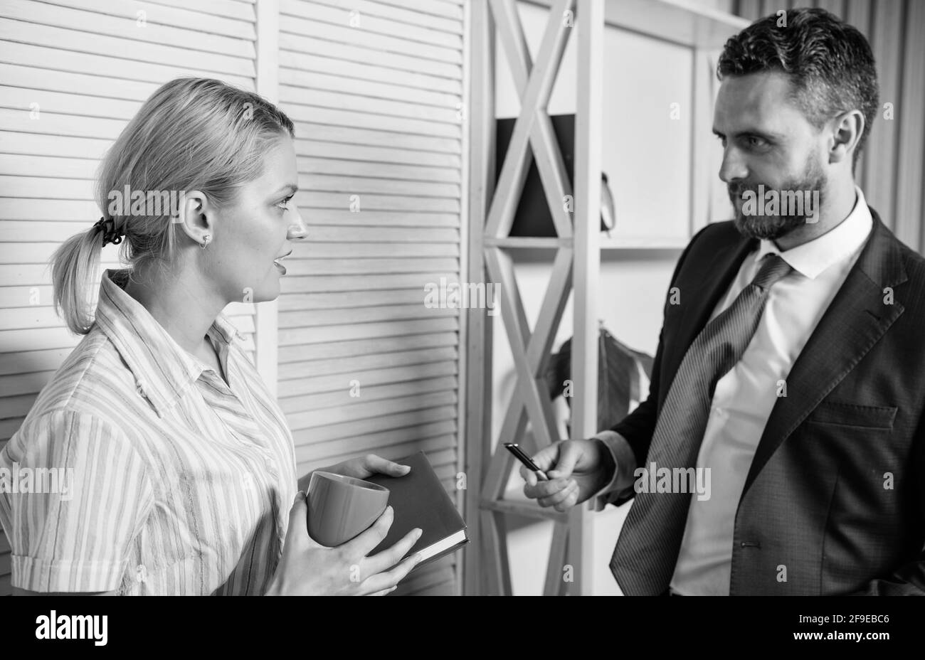 love affair at work. business couple. handsome man speak to cute woman ...