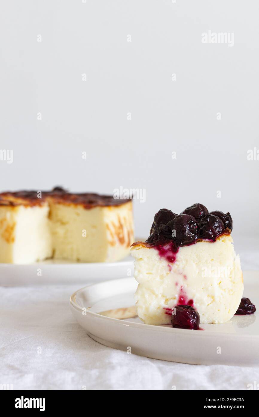 Delicious slices of baked cheesecake topped with berry jam served on a ...