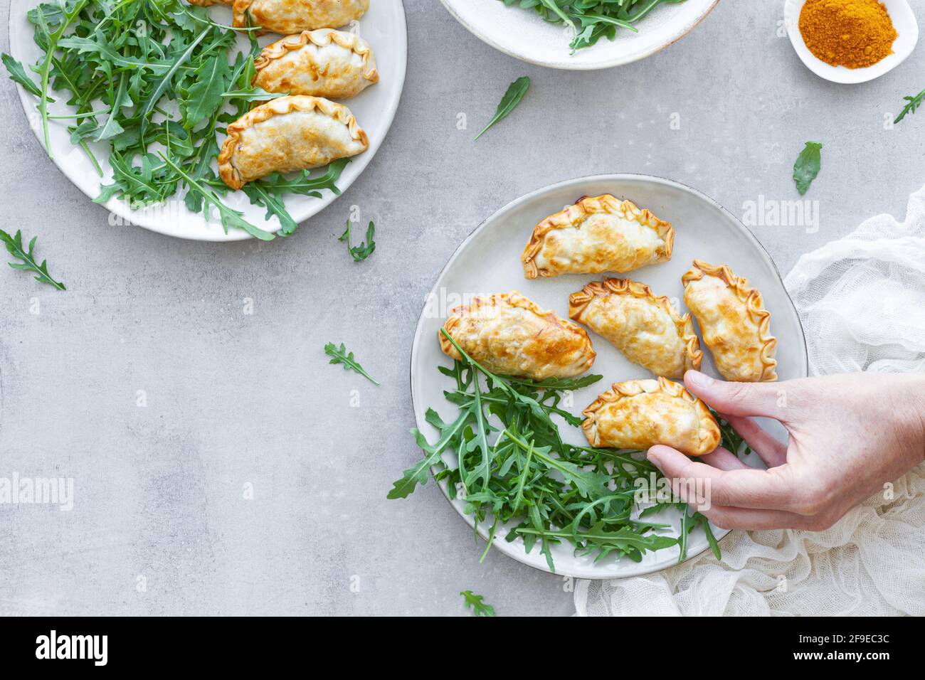 Top view of delicious plate of chicken curry turnovers Stock Photo - Alamy