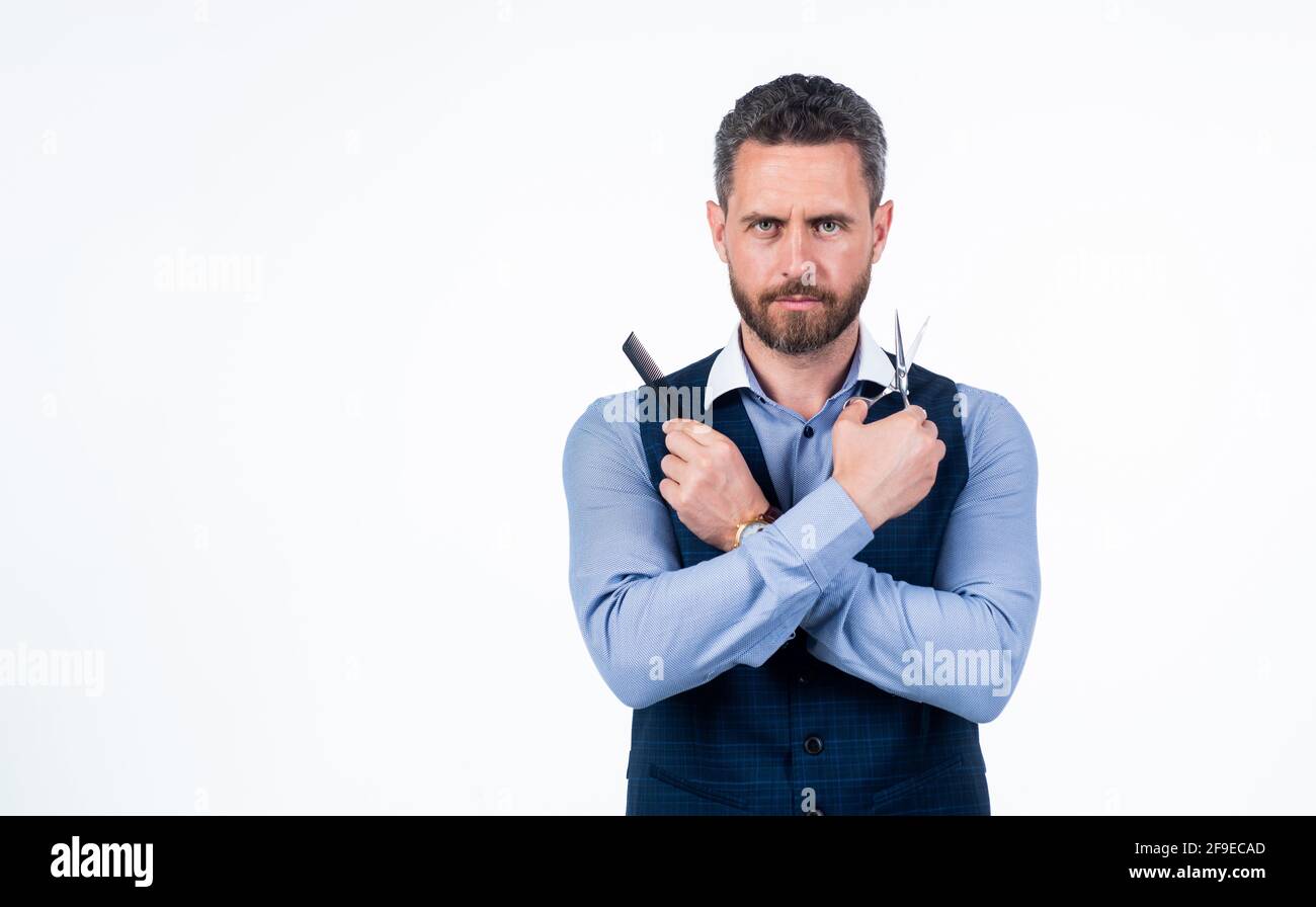 handsome man hold comb and barber scissors, copy space, barbershop ...