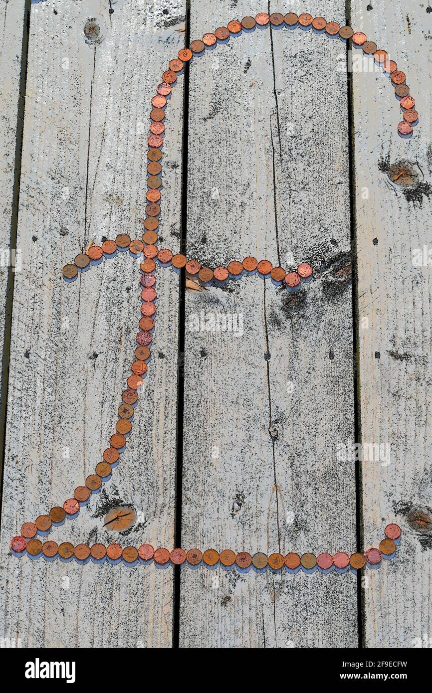 Sterling One Pound of Pennies in the shape of a Sterling symbol Stock ...