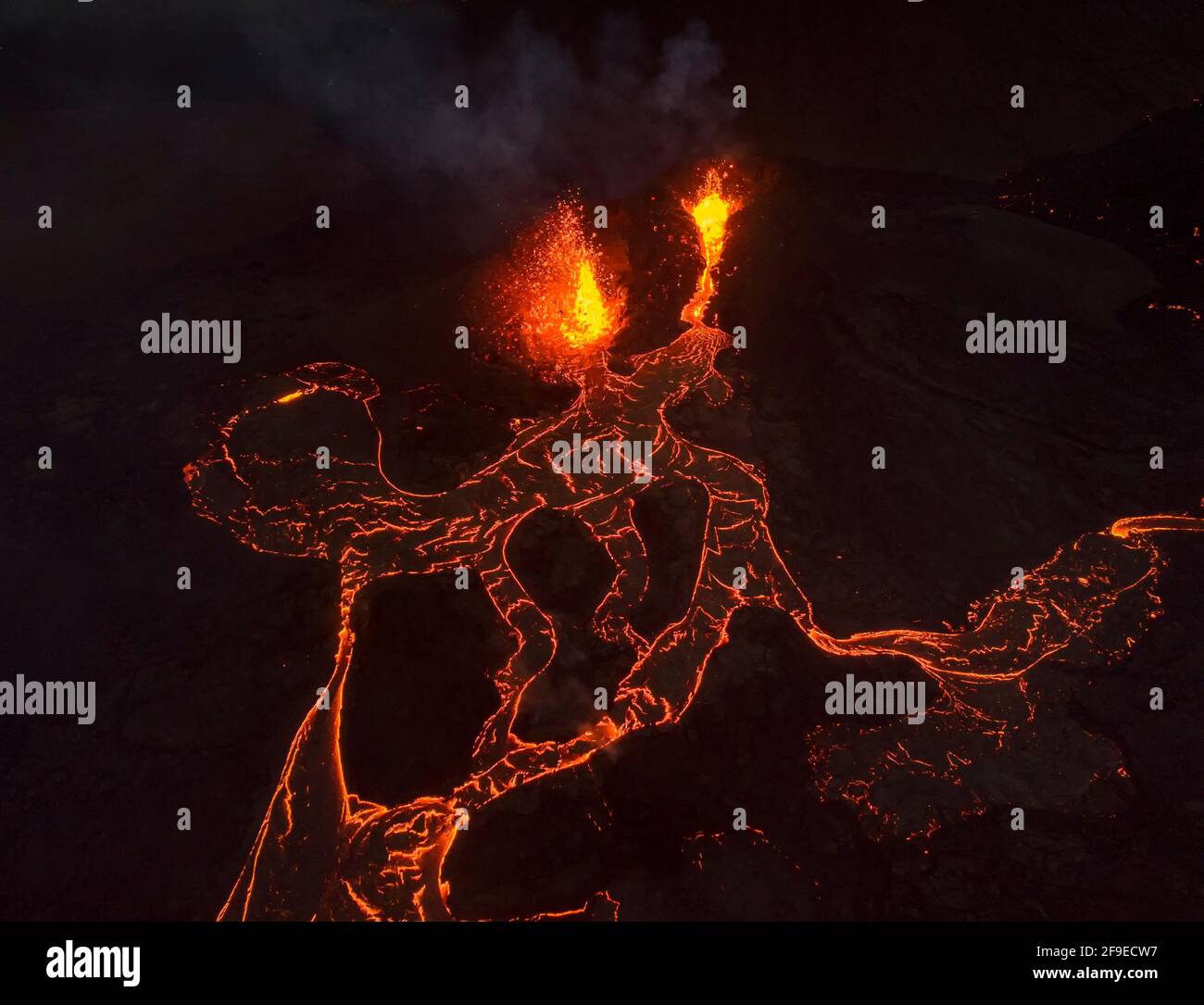From above magma sparks out of the volcano hole and run like rivers of ...