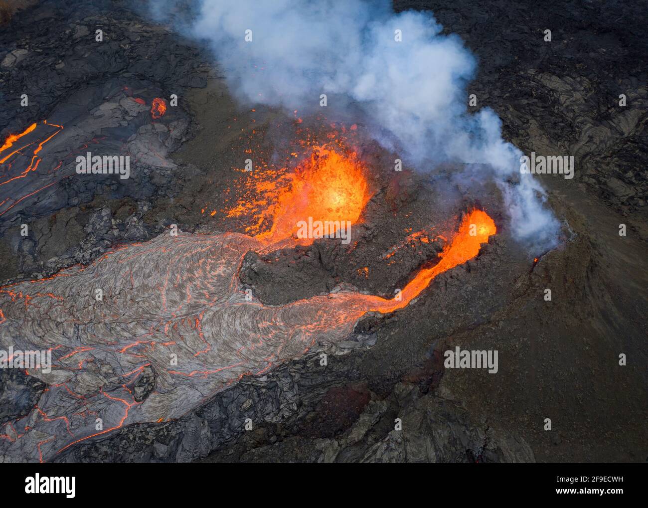 From above magma sparks out of the volcano hole and run like rivers of ...