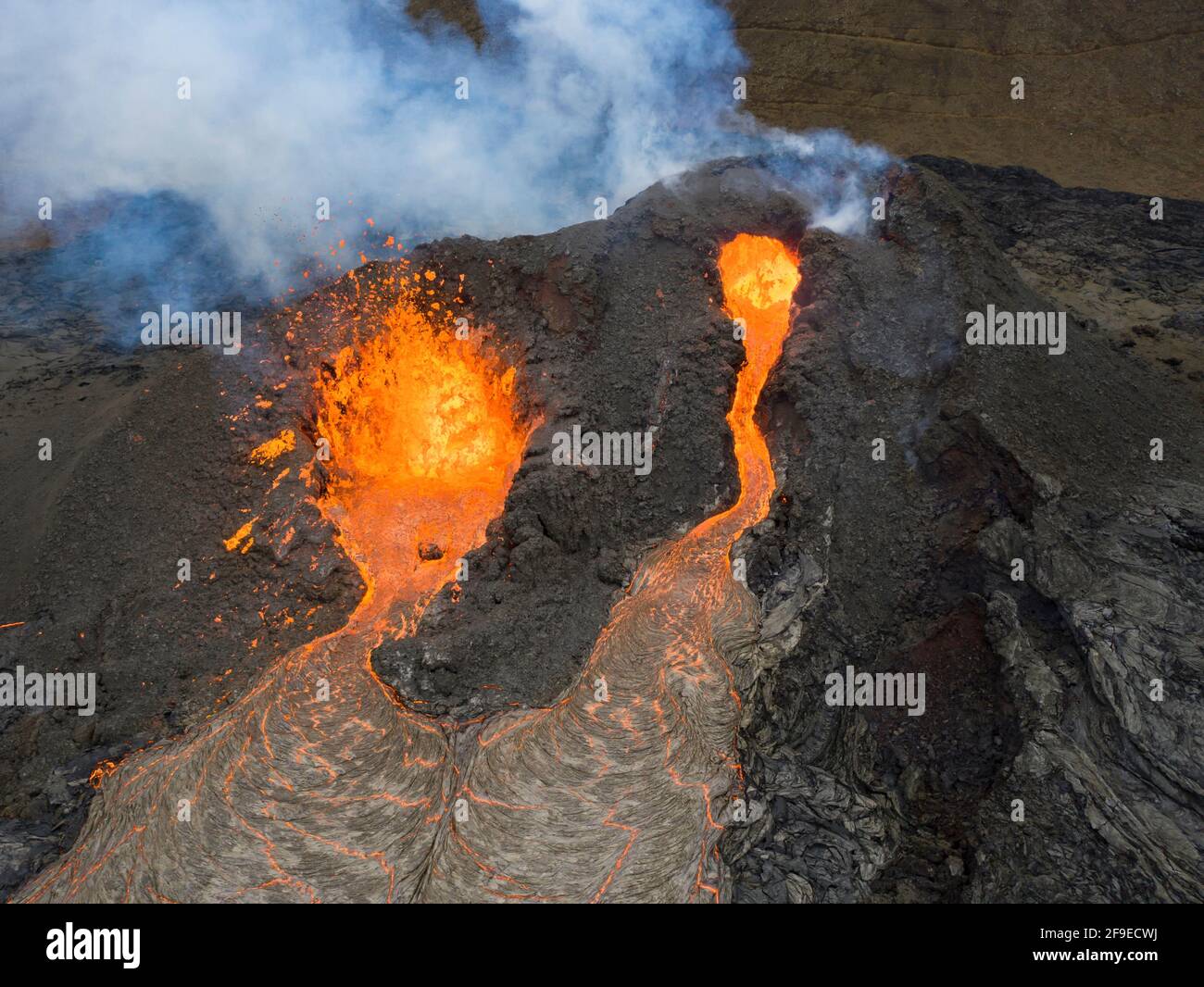From above magma sparks out of the volcano hole and run like rivers of ...