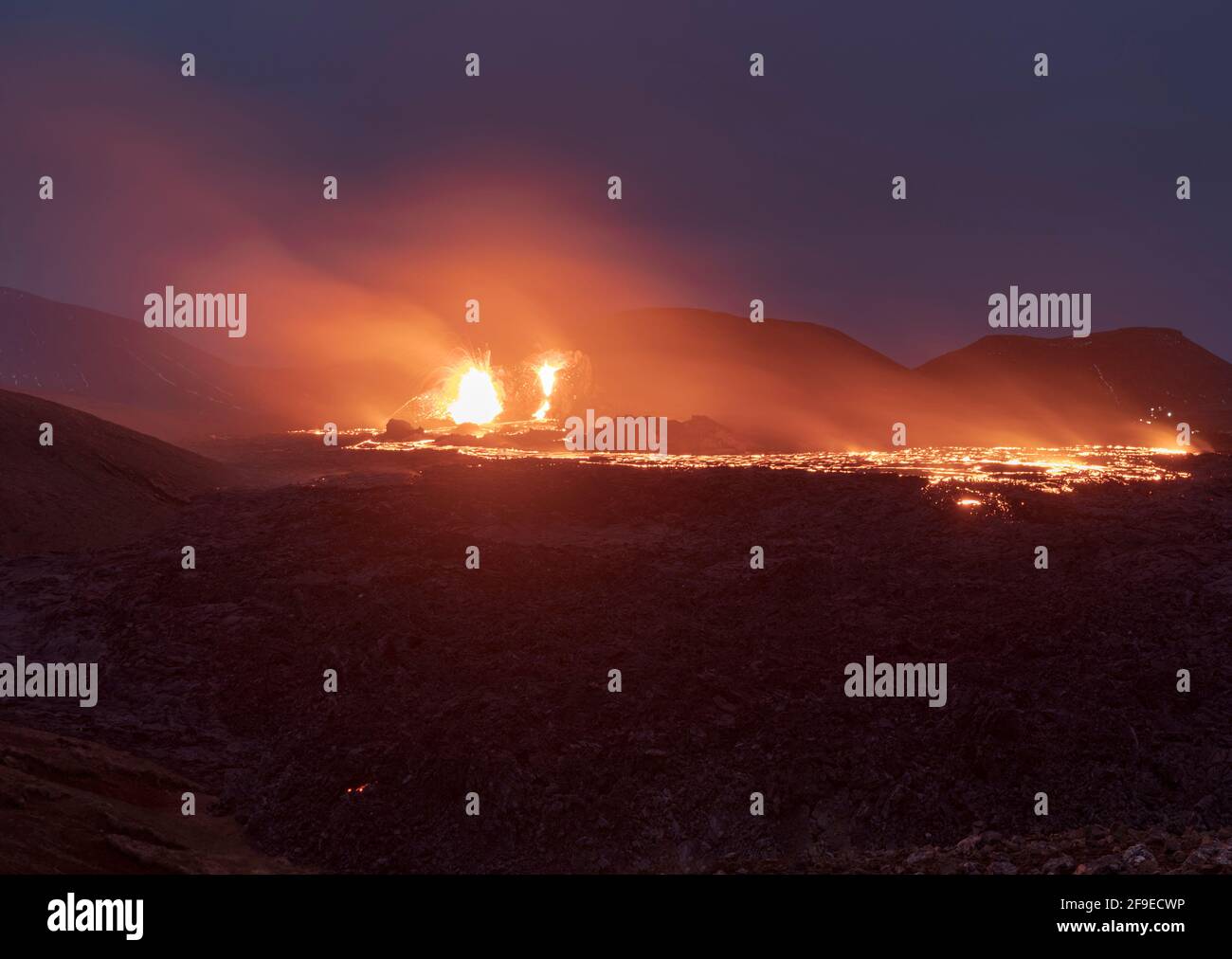 From above magma sparks out of the volcano hole and run like rivers of ...