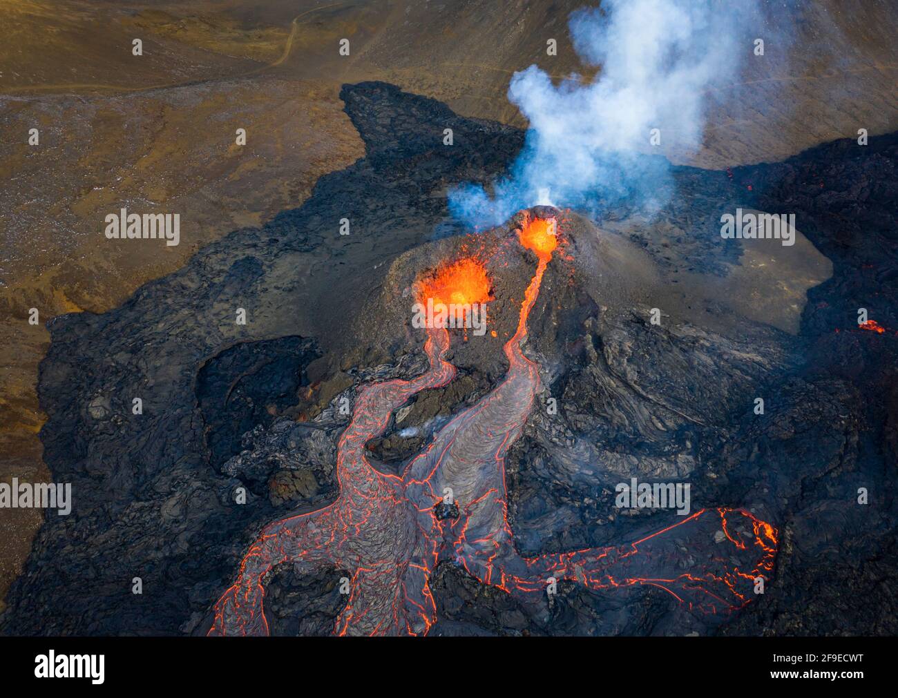 From above magma sparks out of the volcano hole and run like rivers of ...