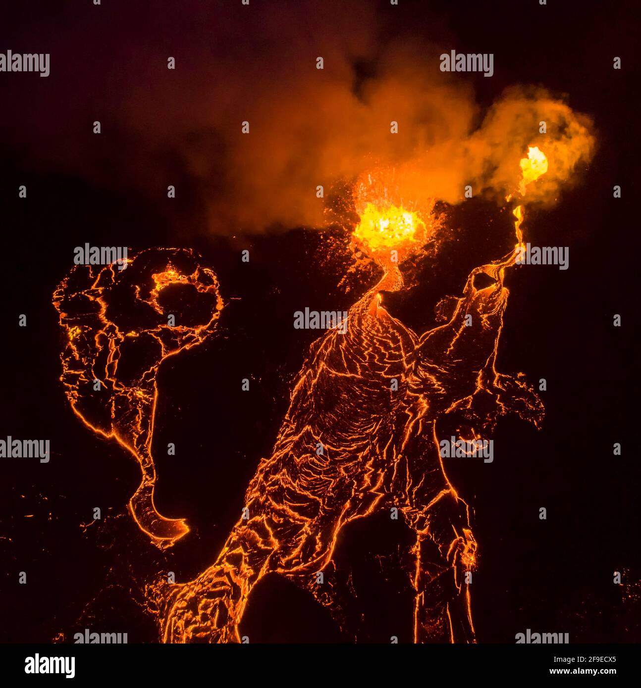 From above magma sparks out of the volcano hole and run like rivers of ...