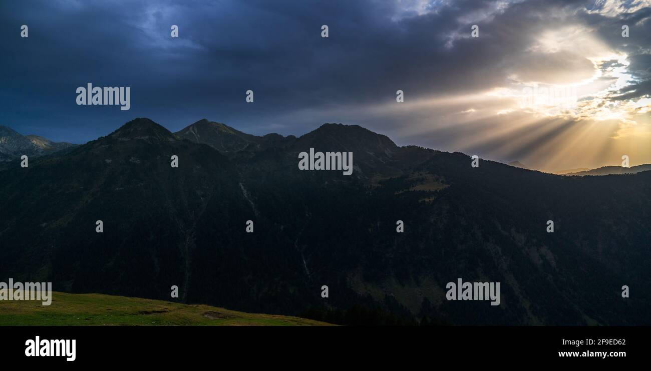 Spectacular landscape of Pyrenees range of Aran valley with sunbeams ...