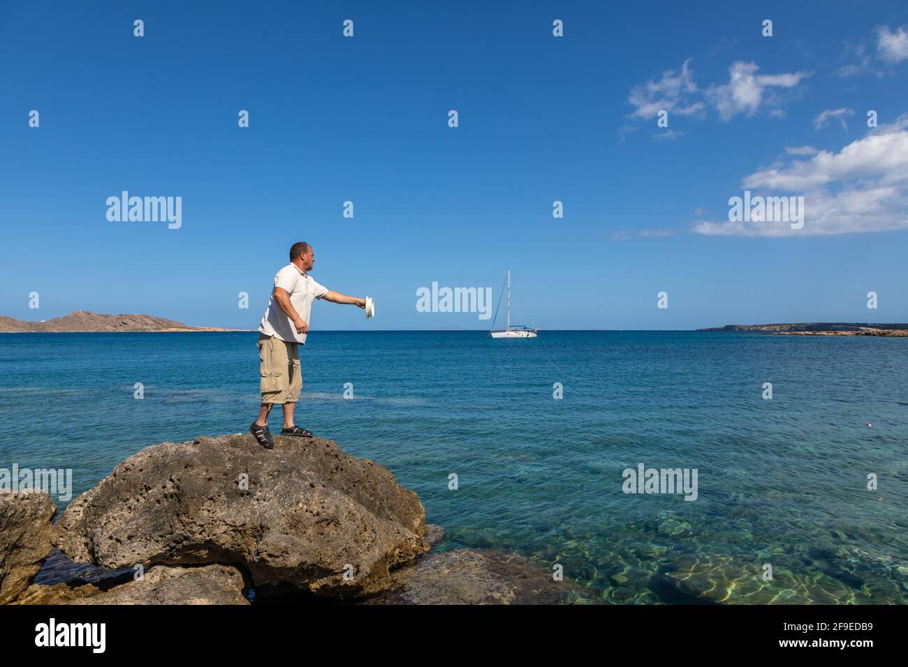 Naoussa, Paros Island, Greece - 27 September 2020: Man fishing on the ...