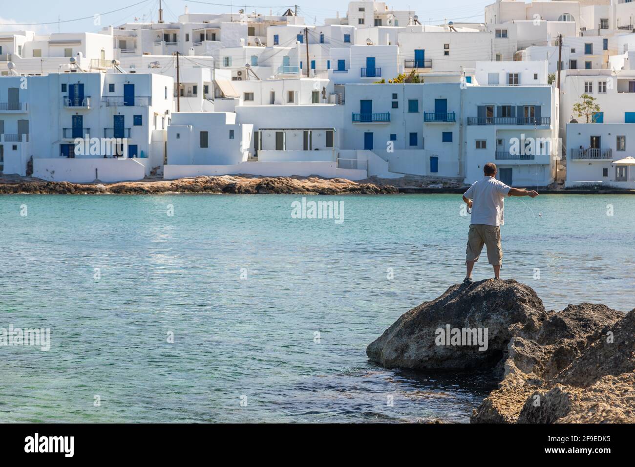 Naoussa, Paros Island, Greece - 27 September 2020: Man fishing on the ...