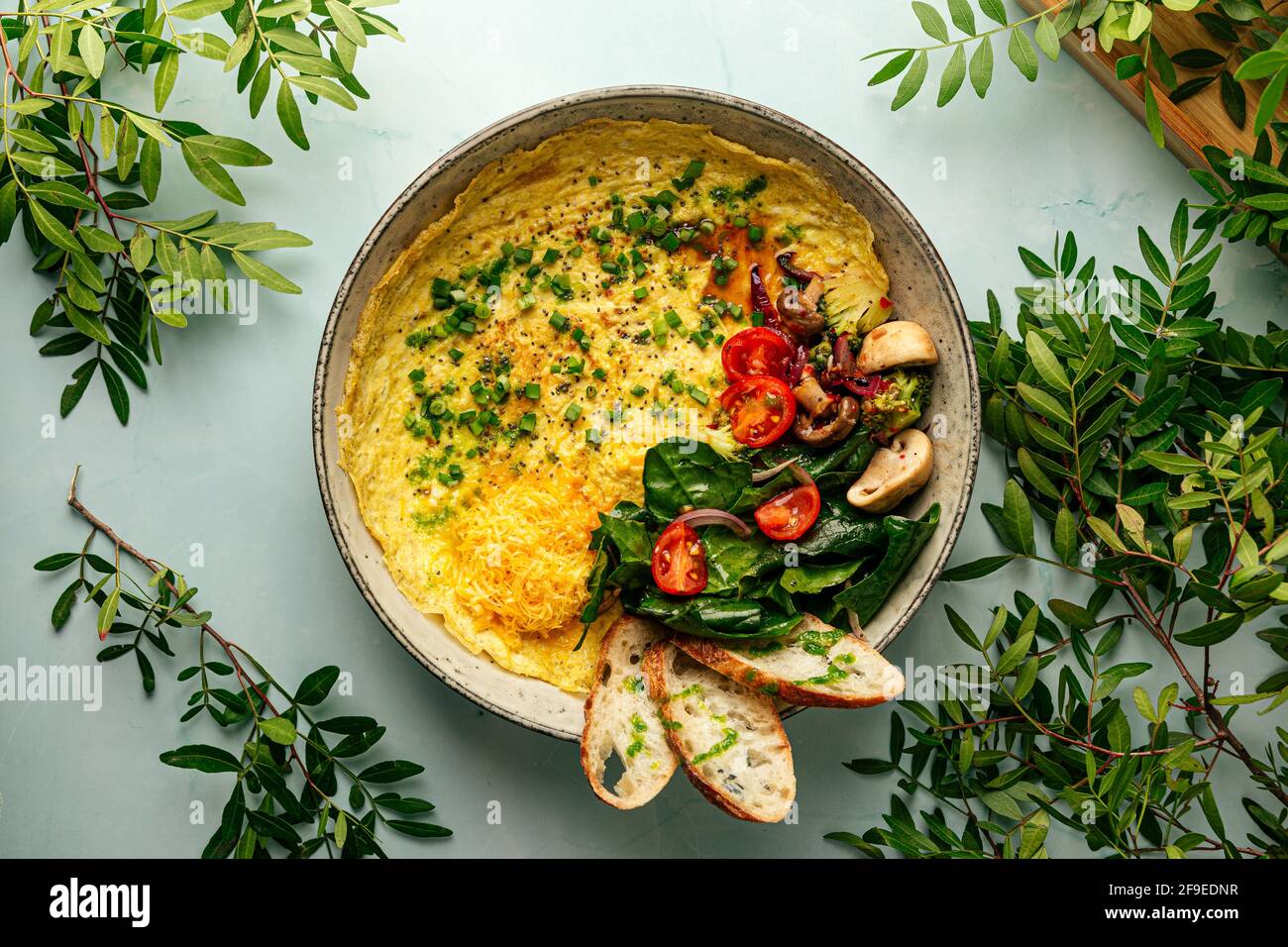 Rustic omelette with vegetables and cheese Stock Photo - Alamy