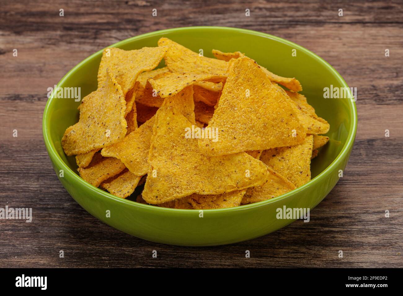Mexican crunchy corn nachos triangle heap Stock Photo - Alamy