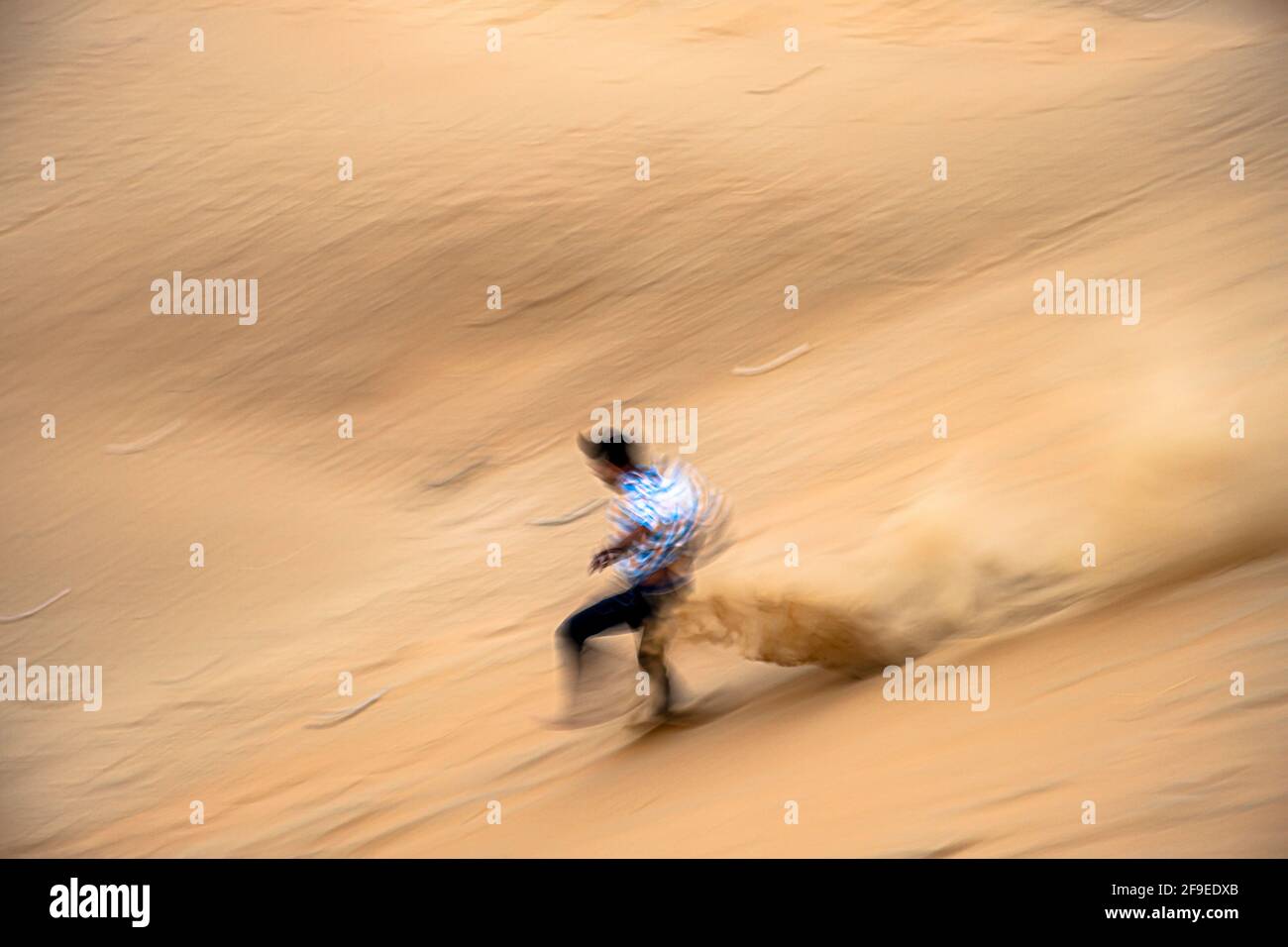 slow shutter speed,motion blur.a man running in desert Stock Photo - Alamy