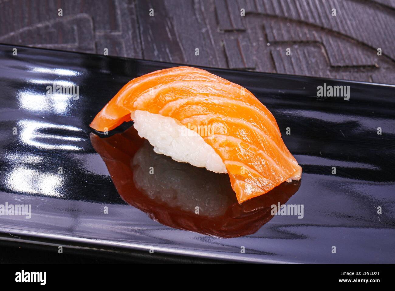 Asian cuisine - sushi with raw salmon Stock Photo - Alamy