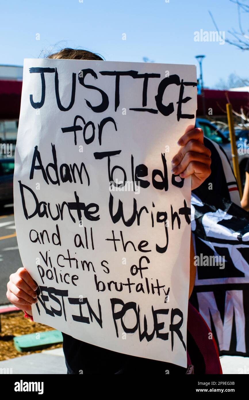 A protestor holding a placard expressing her opinion, during the march ...