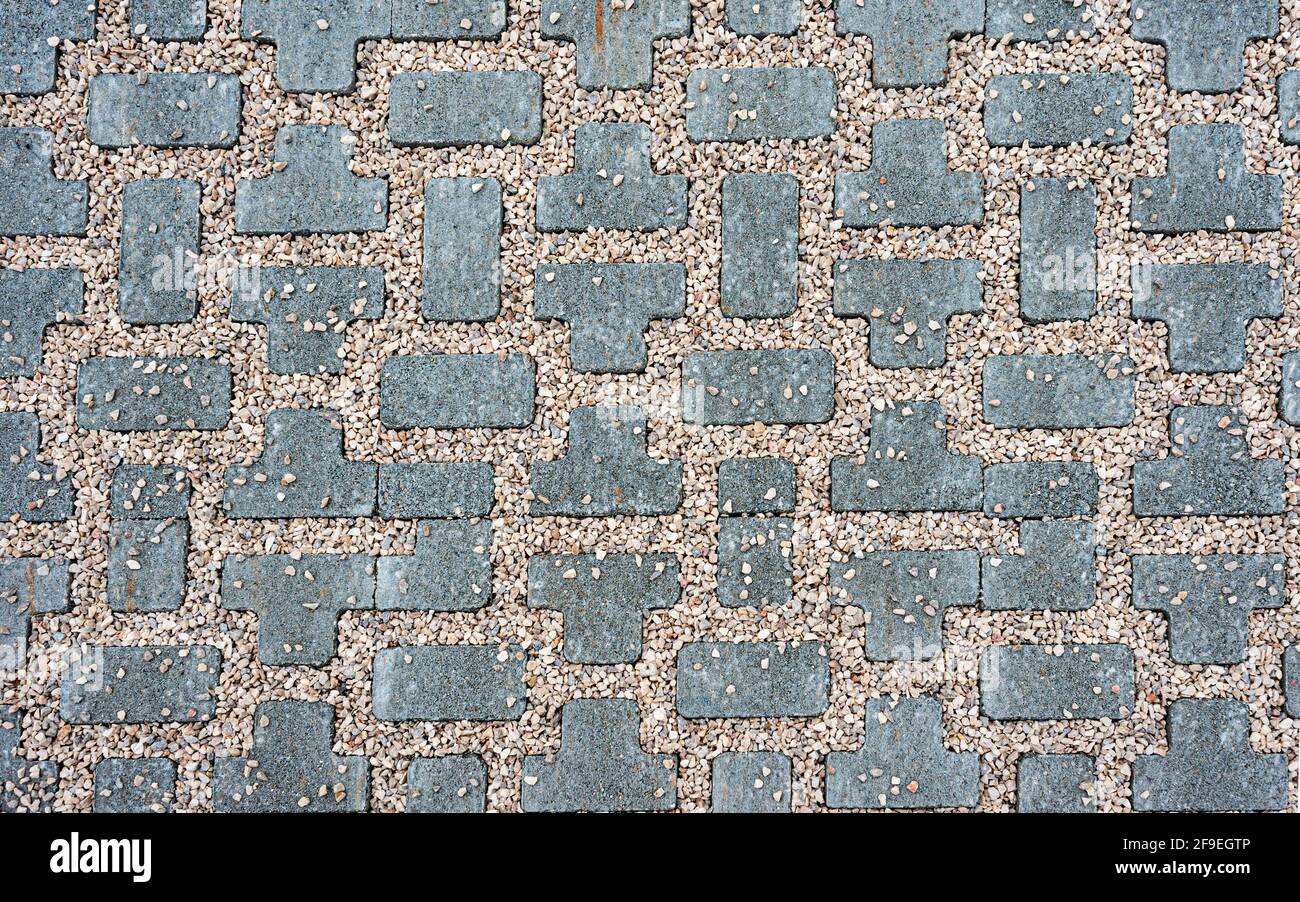 Interlocking paving with gray and white concrete blocks; Concrete ...