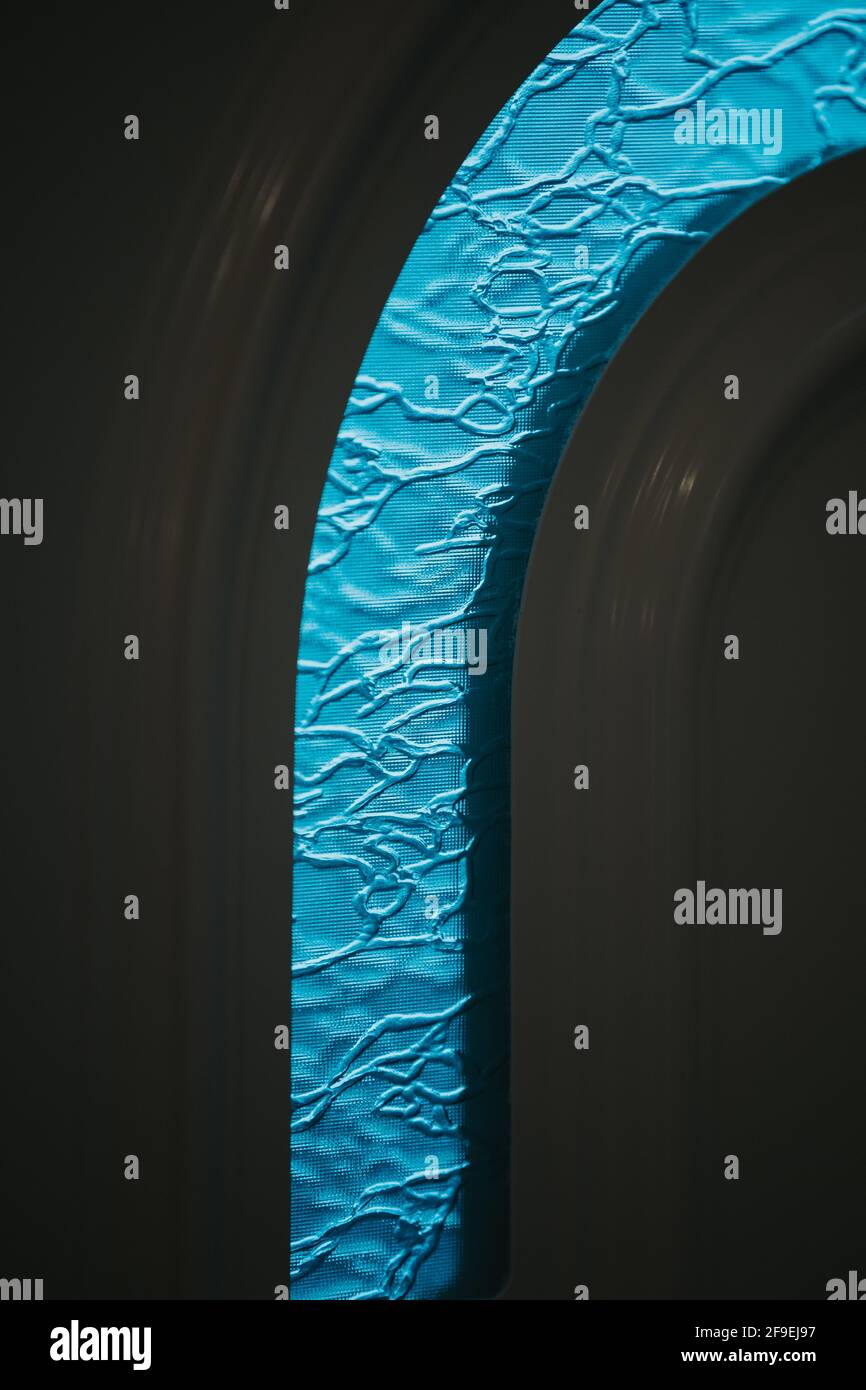 A vertical shot of a creative blue textured window detail on a UPVC ...