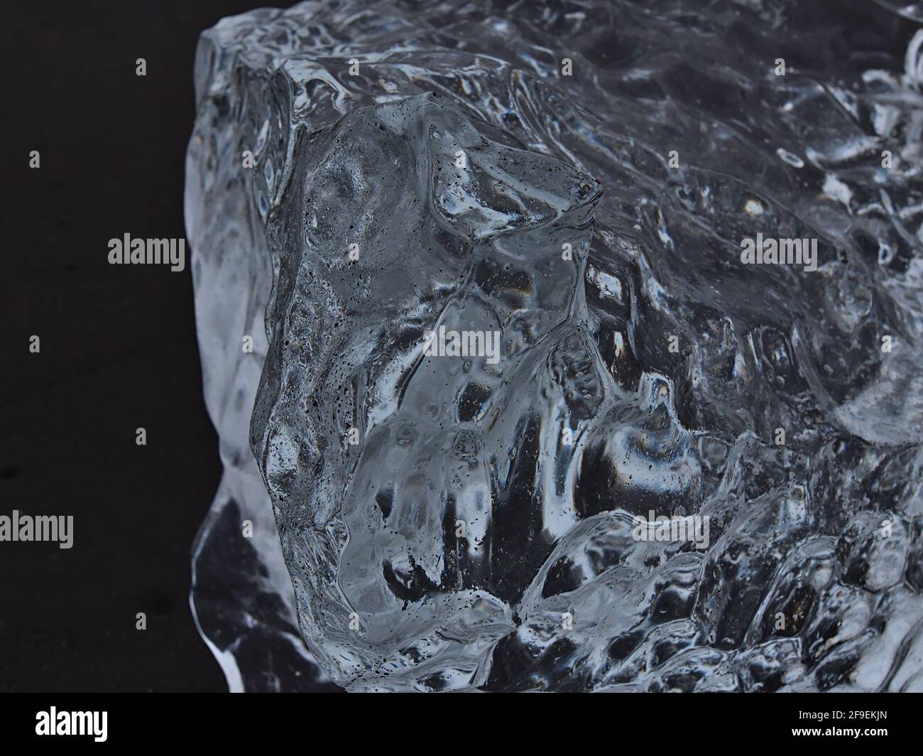 Closeup view of small iceberg with clear, shimmering ice surface on the ...