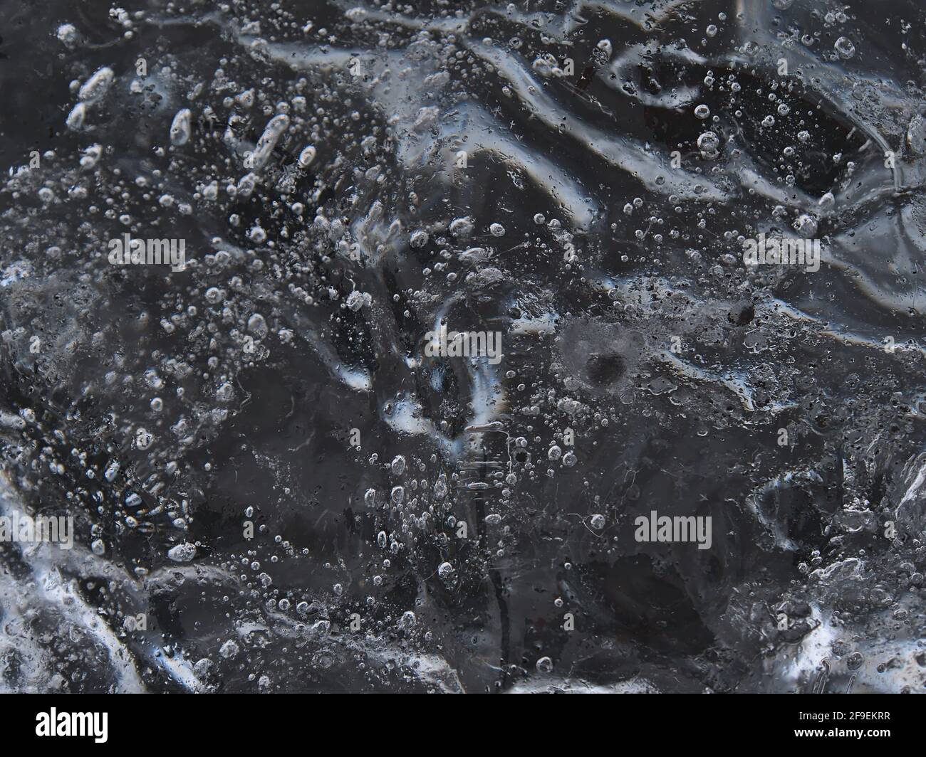 Closeup view of small iceberg with transparent, shimmering ice surface ...