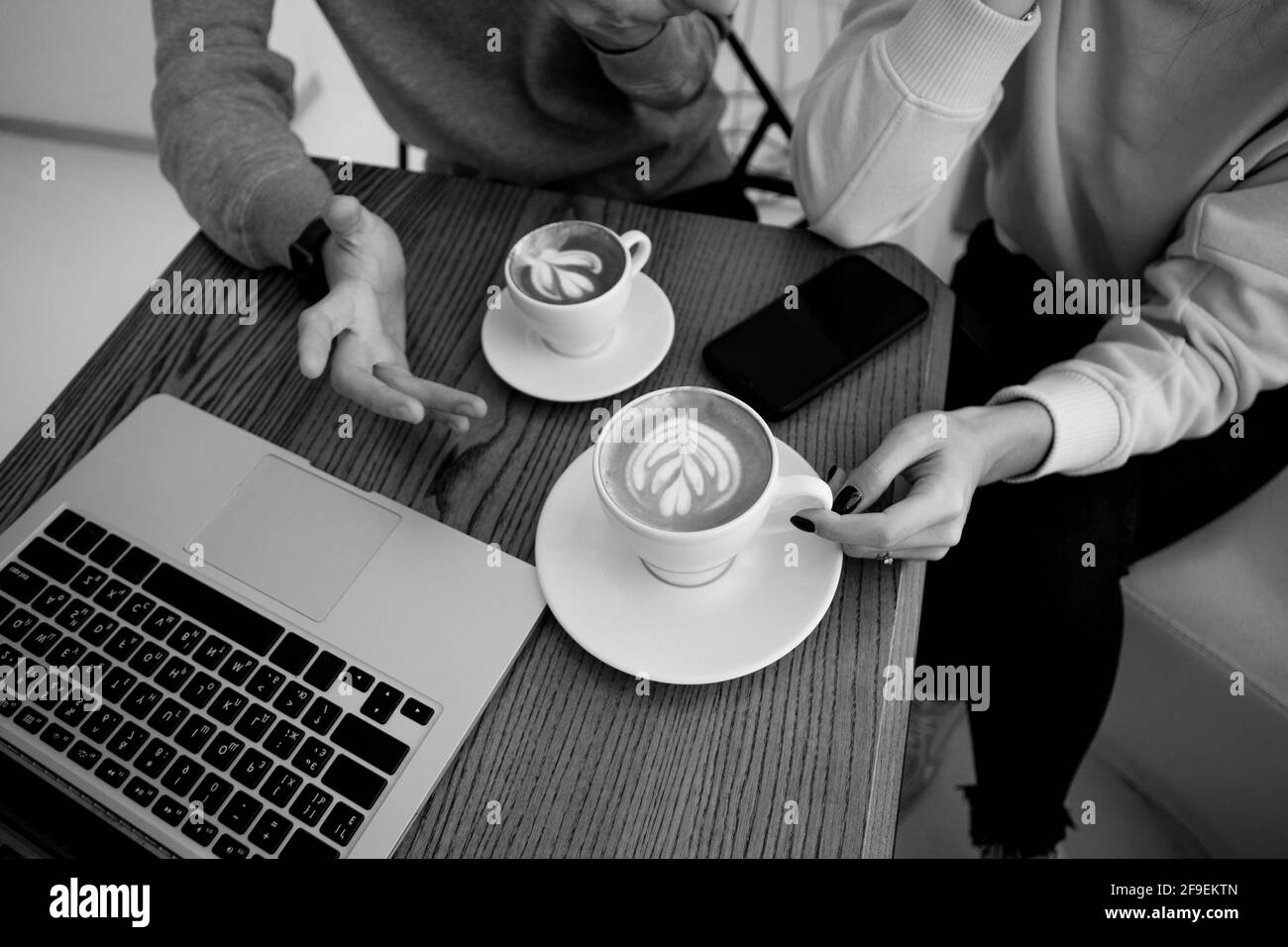 Laptop discussing Black and White Stock Photos & Images - Alamy