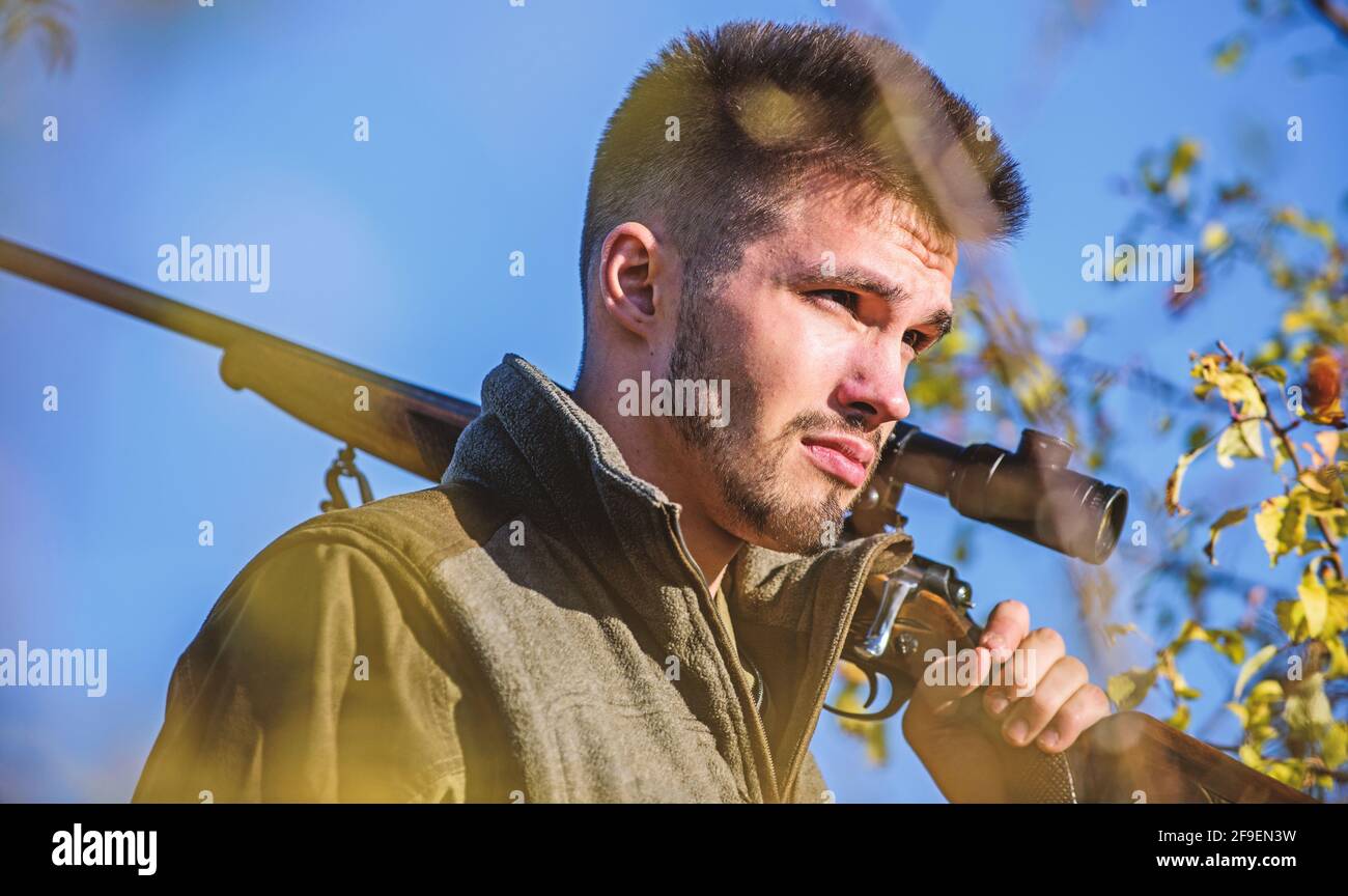 Man hunter with rifle gun. Boot camp. Hunting skills and weapon ...