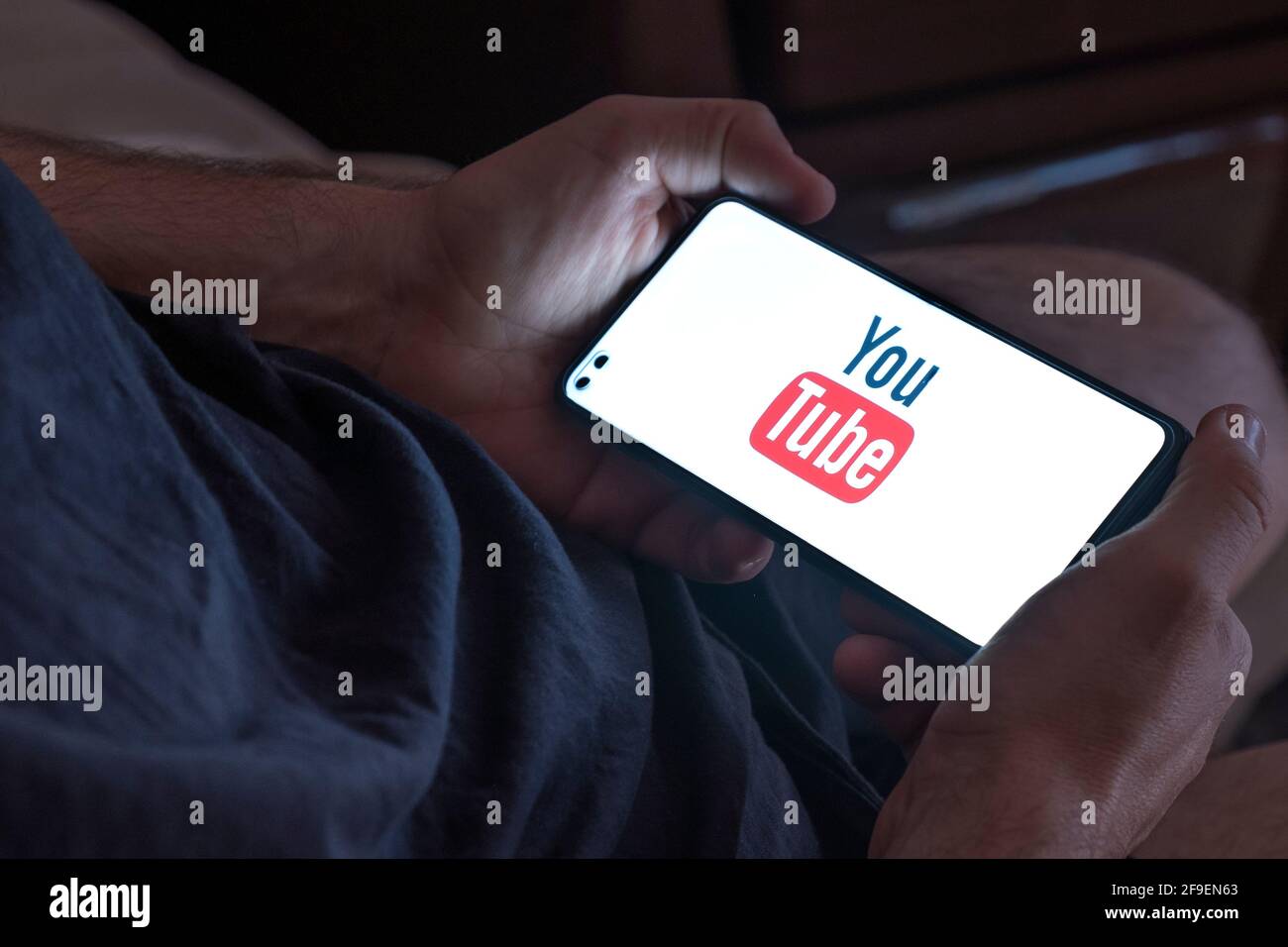 Spain. 04, 18, 2021. Close-up of a man holding a smartphone with the ...