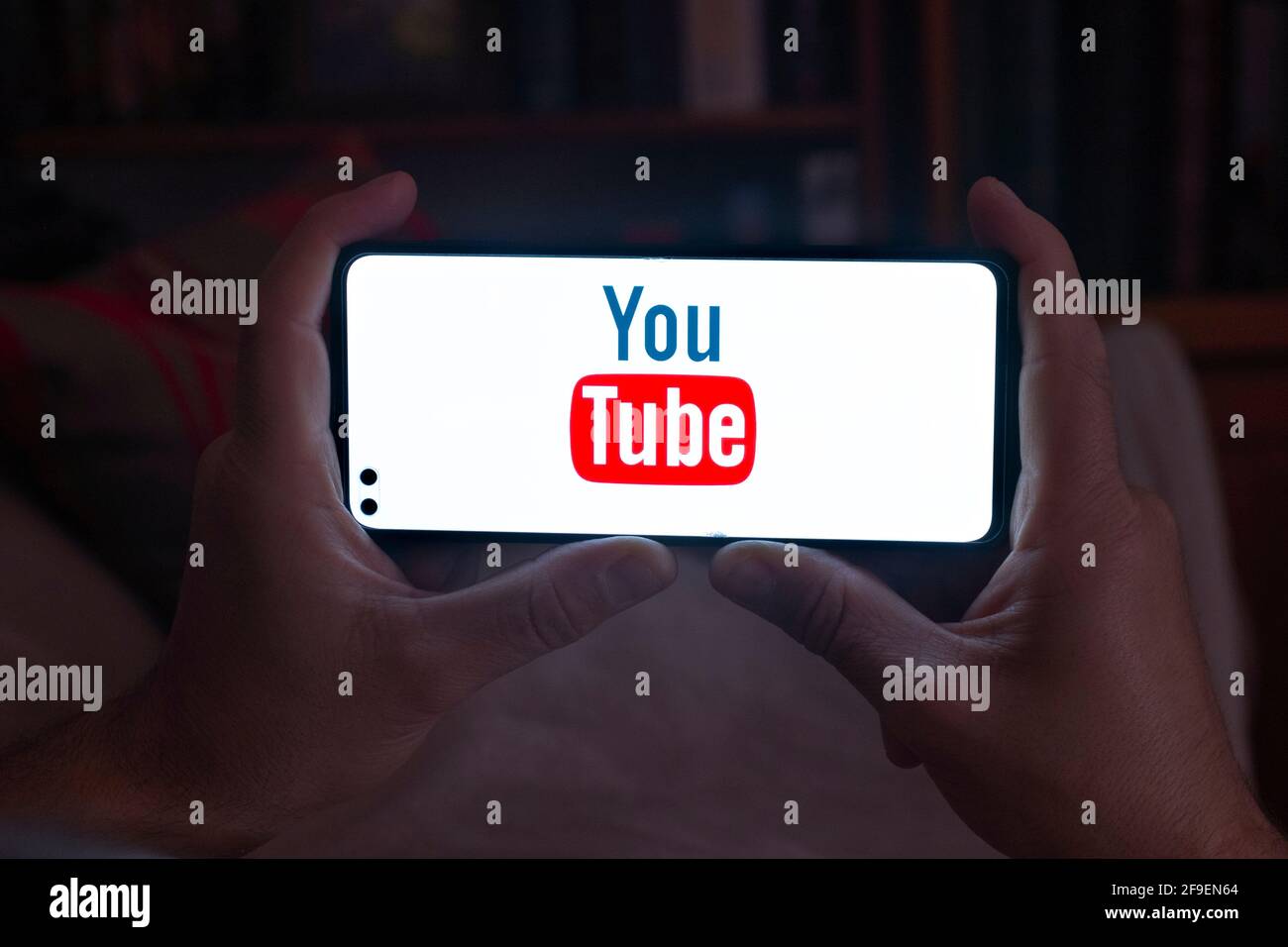 Spain. 04, 18, 2021. Close-up of a man holding a smartphone with the ...