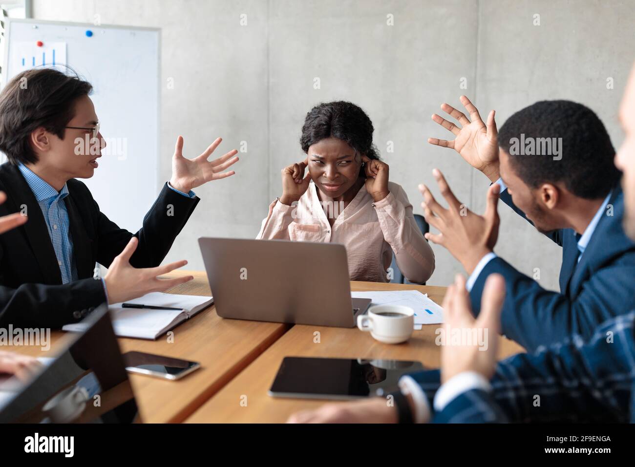 Angry Colleagues Shouting At Female Manager During Meeting In Office ...