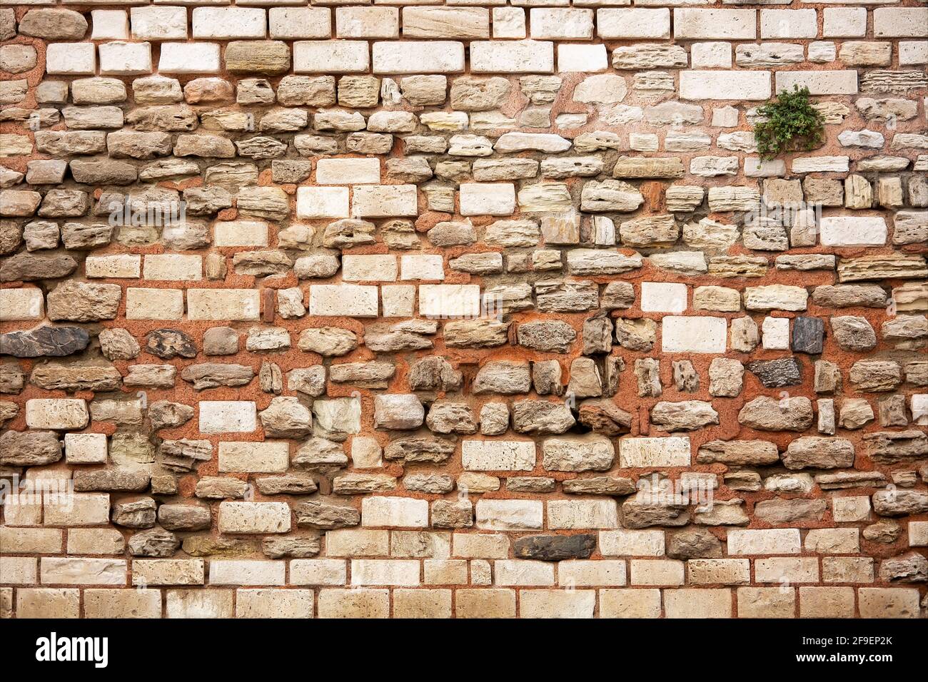 Old wall built of brick and stone, historic background Stock Photo - Alamy