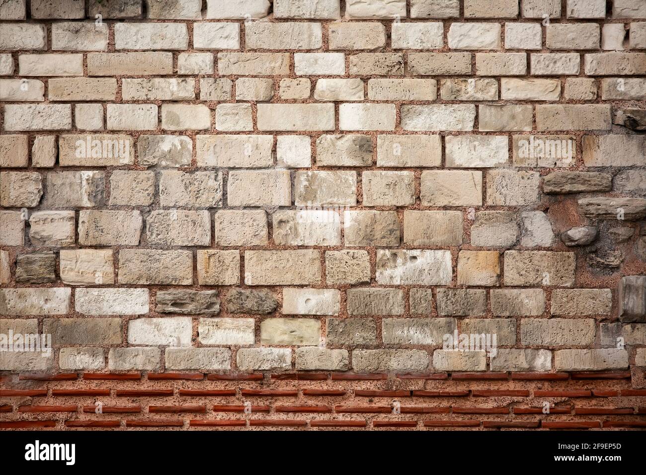 Old wall built of brick and stone, historic background Stock Photo - Alamy