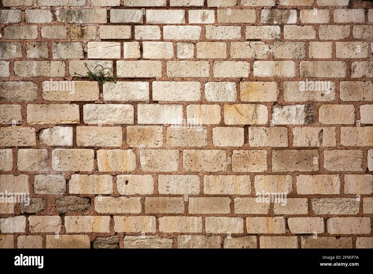 Old wall built of brick and stone, historic background Stock Photo - Alamy