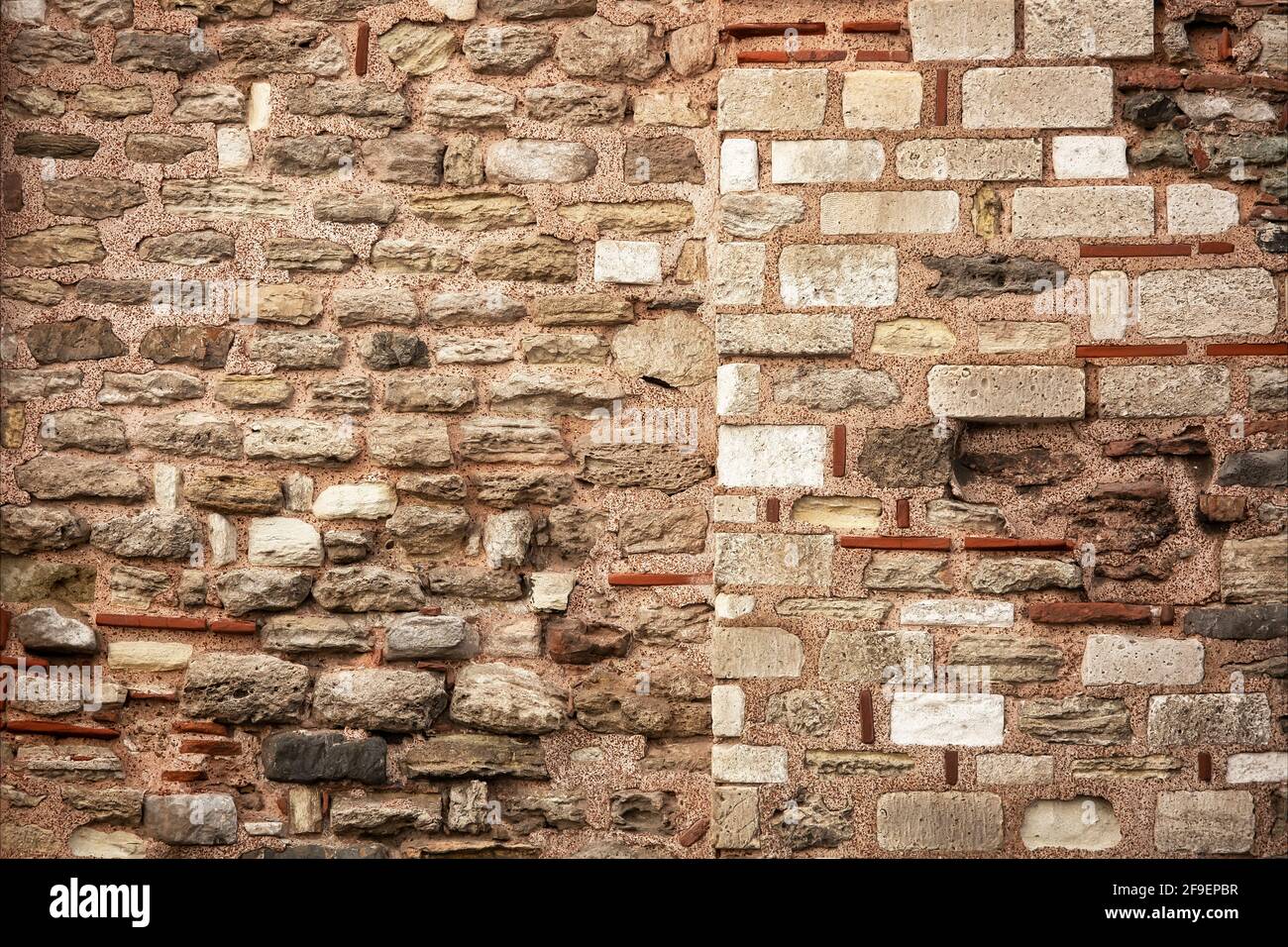 Old wall built of brick and stone, historic background Stock Photo - Alamy