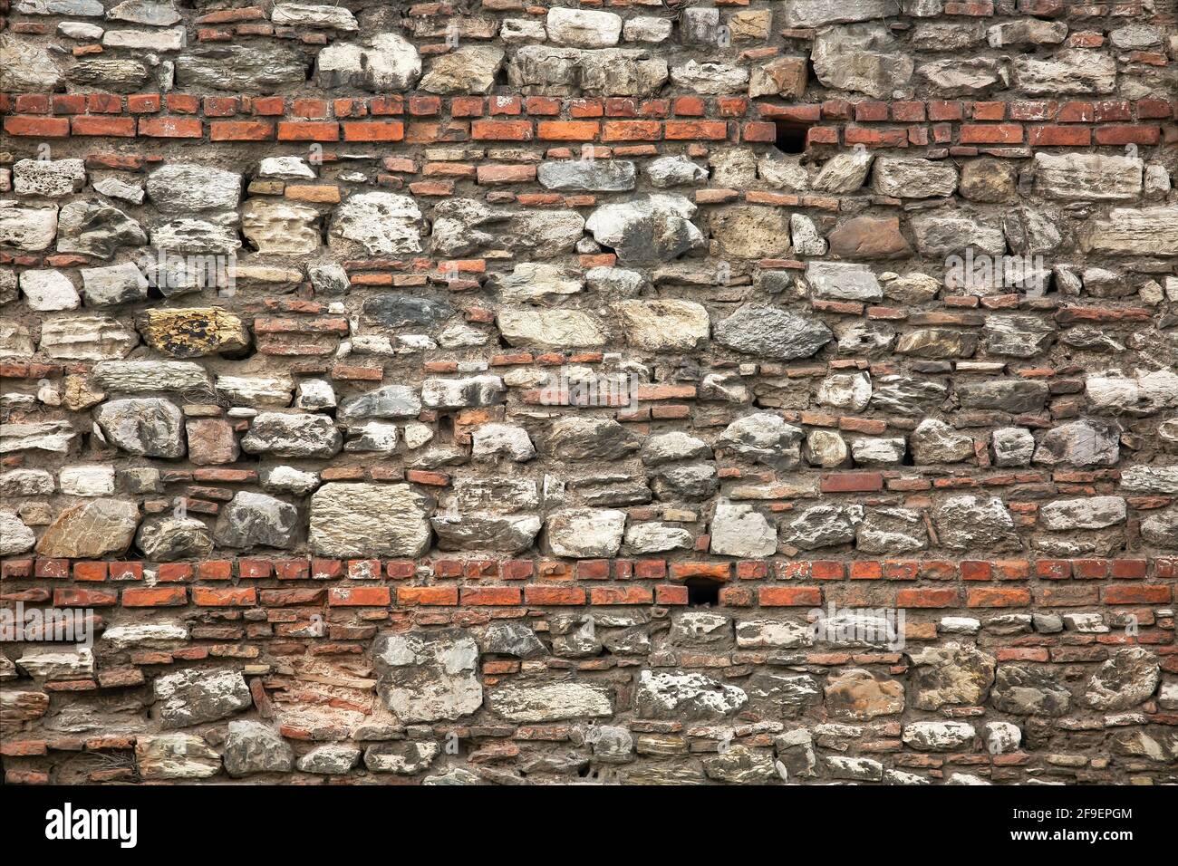 Old wall built of brick and stone, historic background Stock Photo - Alamy