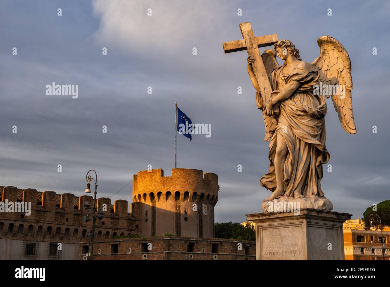 Angel with the Cross and Castel Sant Angelo in the background at sunset ...