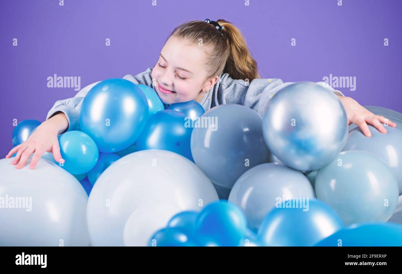 Girl between air balloons. Birthday party. Childrens day. Carefree ...