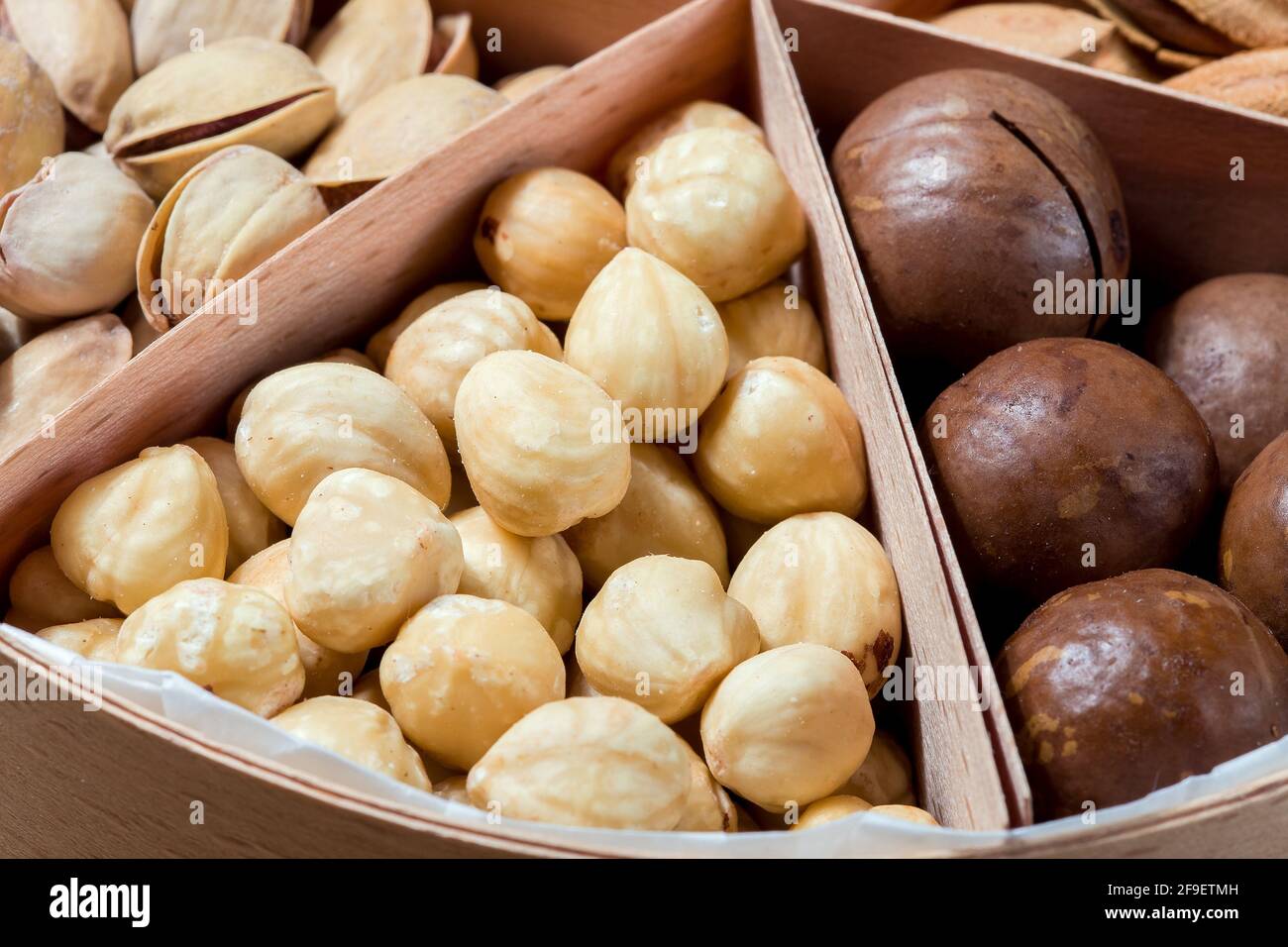 wooden box with cells for different nuts food for healthy protein ...
