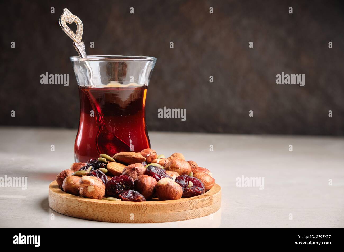 Turkish tea and nut mix at table Stock Photo - Alamy