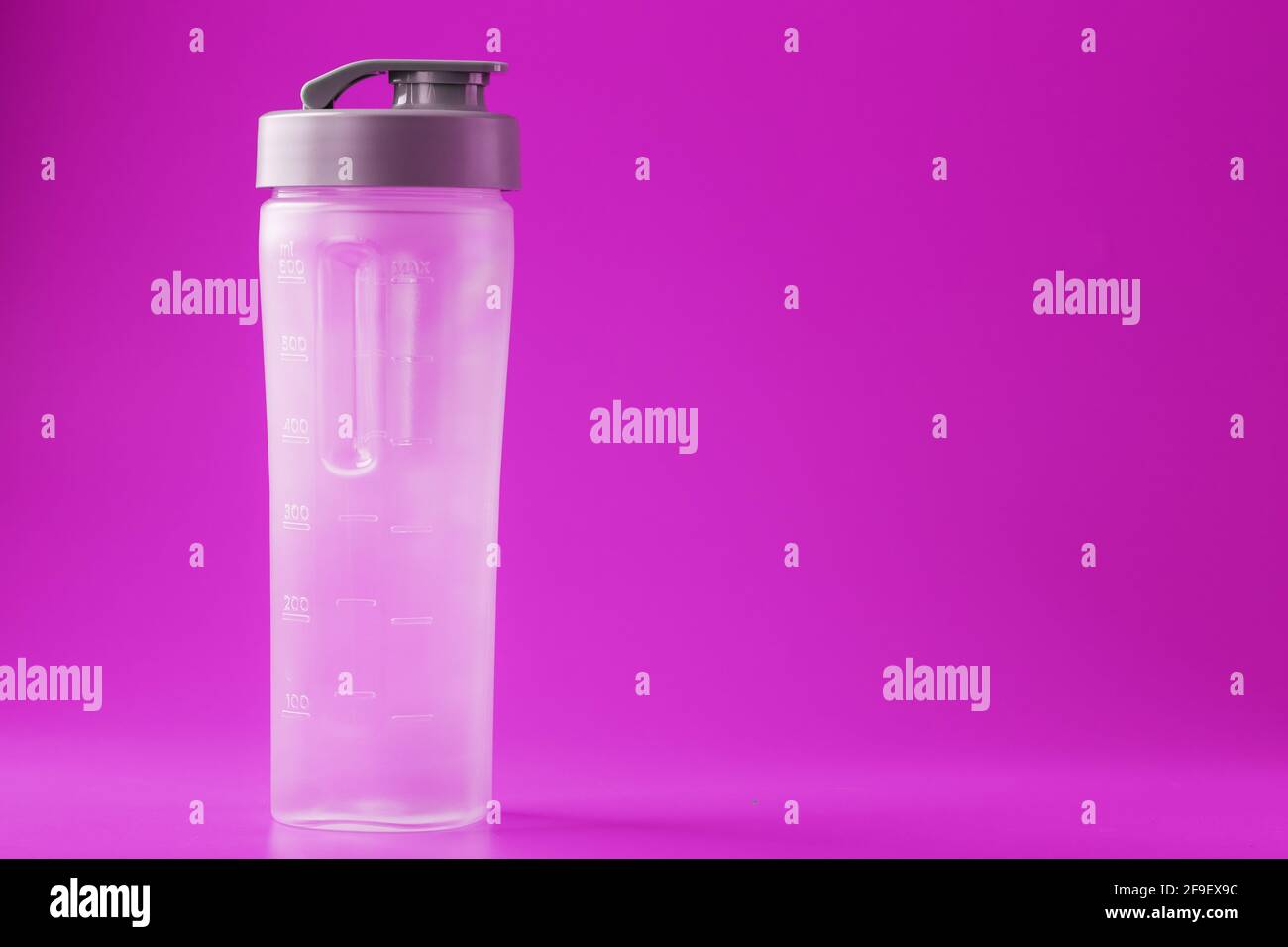 Sports smoothie bottle on pink background. Free space, minimalistic ...
