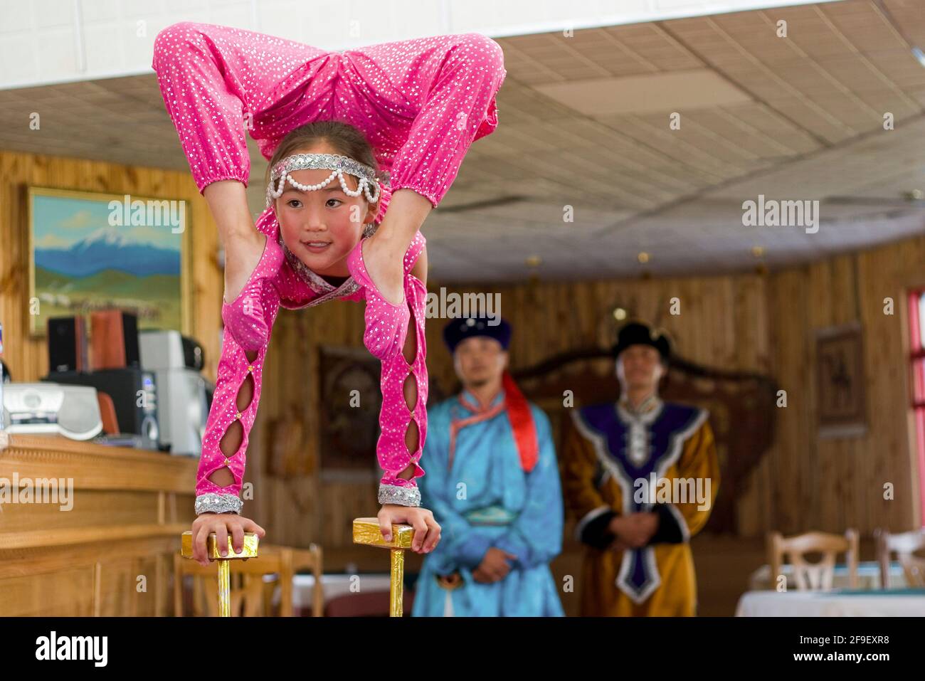 Young mongolian acrobat in traditional costume Stock Photo - Alamy