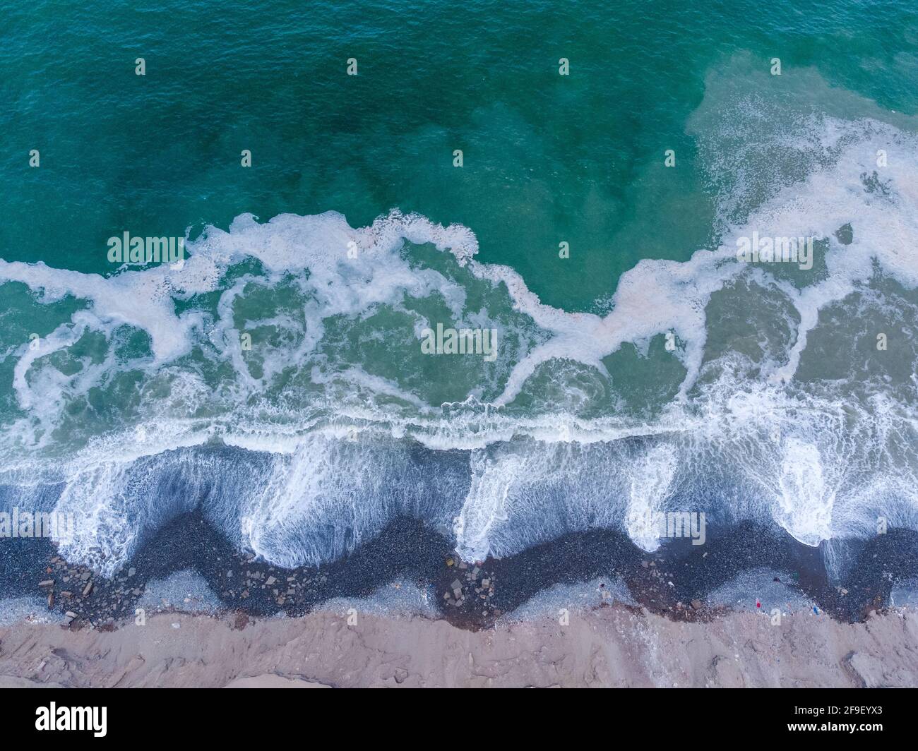 Aerial view of turquoise waves reaching the shore Stock Photo - Alamy