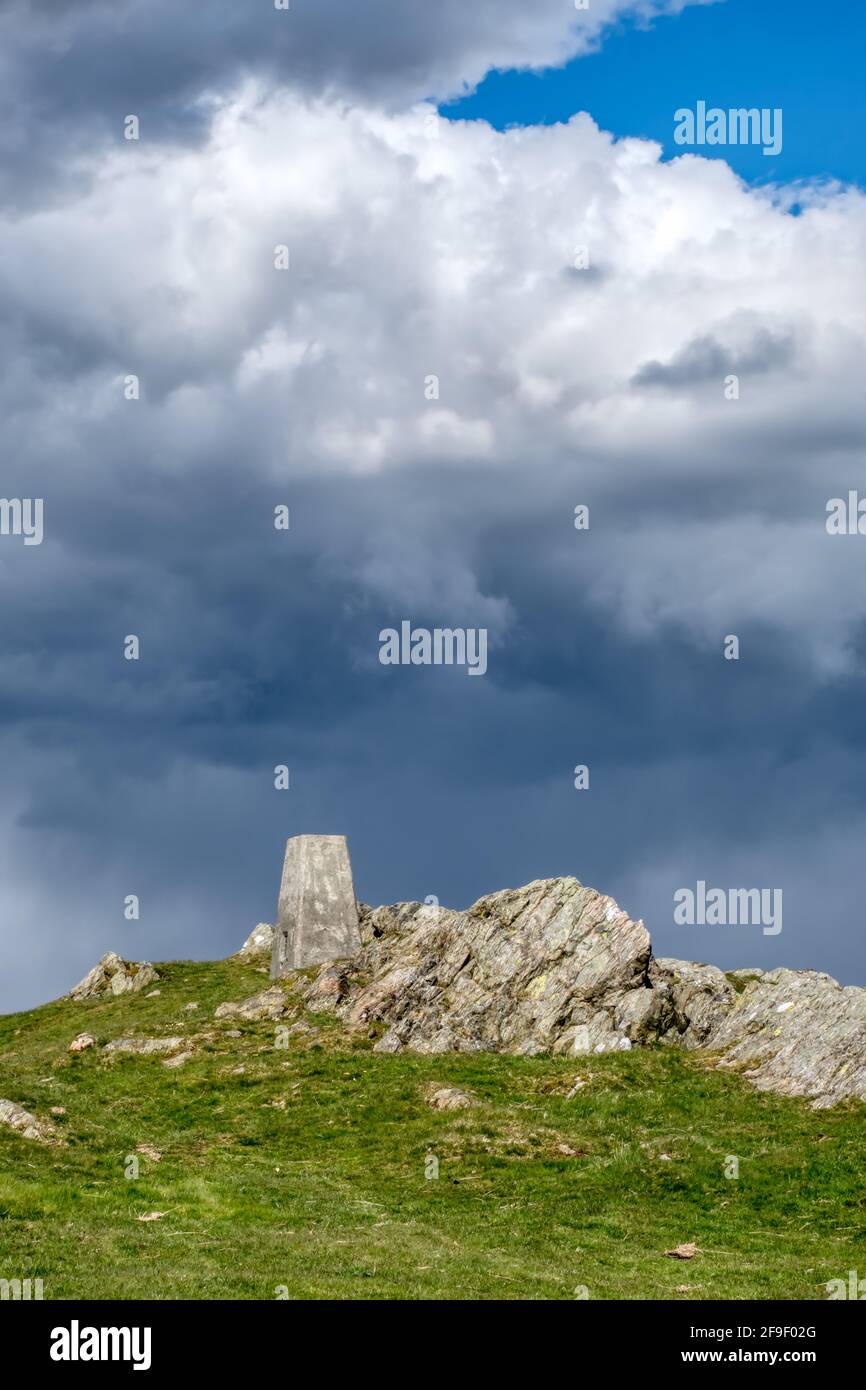 Trig Point & Storm Clouds Stock Photo - Alamy