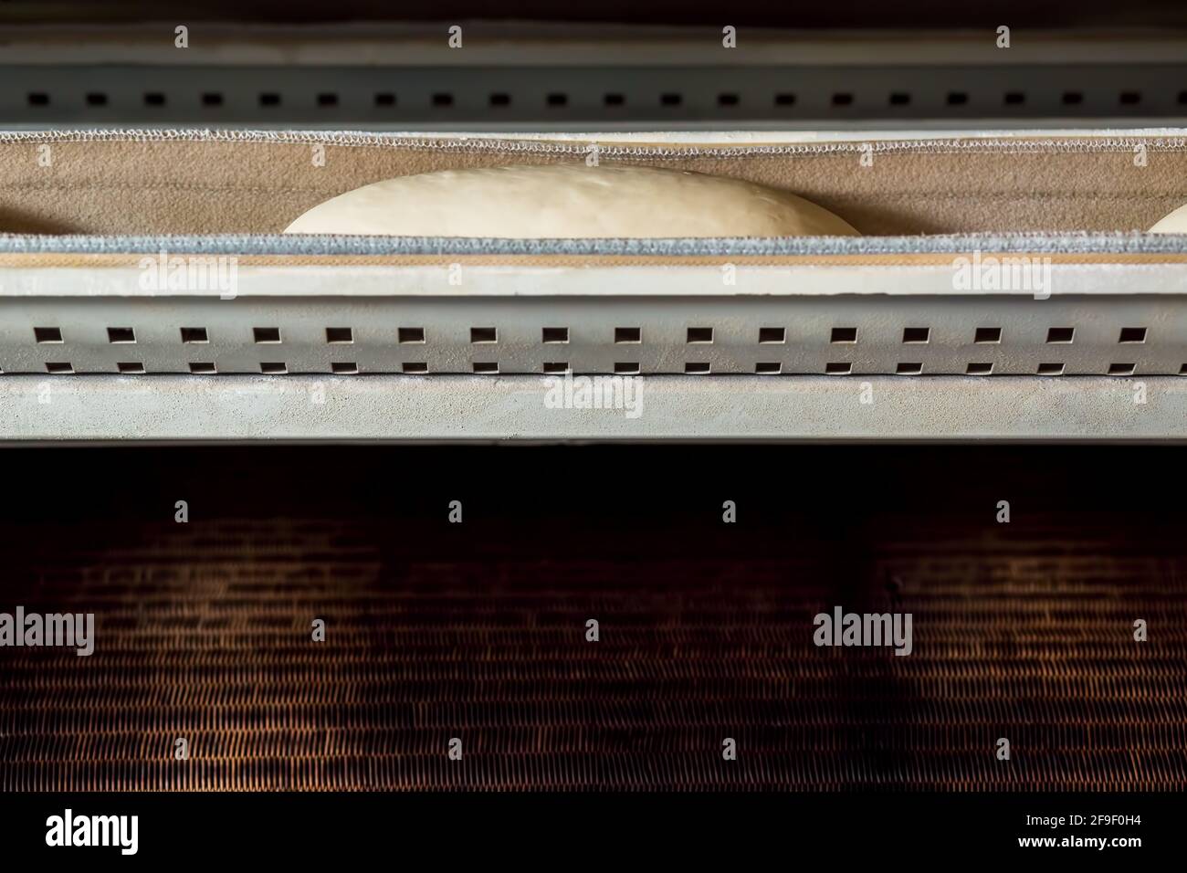 Production of bakery products at industrial factory. Raw dough at ...
