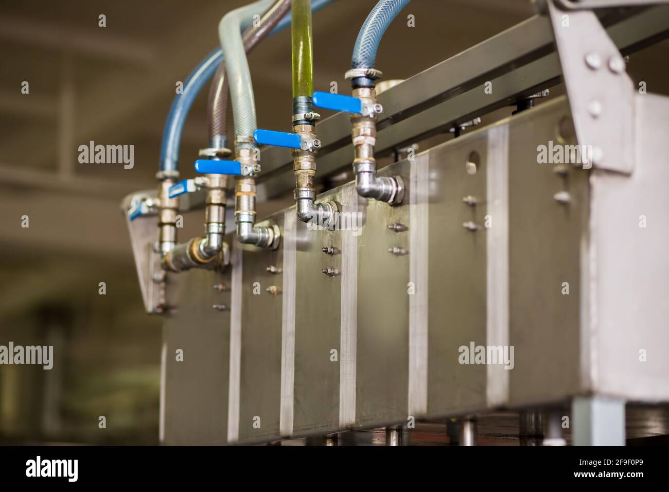 Stainless steel food processing facility. Blurred factory interior ...