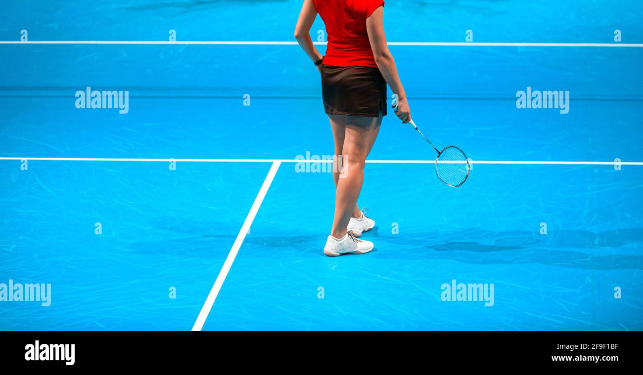 Badminton player beats the shuttlecock in the arena Stock Photo - Alamy