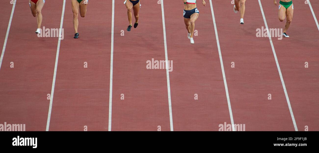 Running woman sprinters runners in 100 meters. Professional sport ...